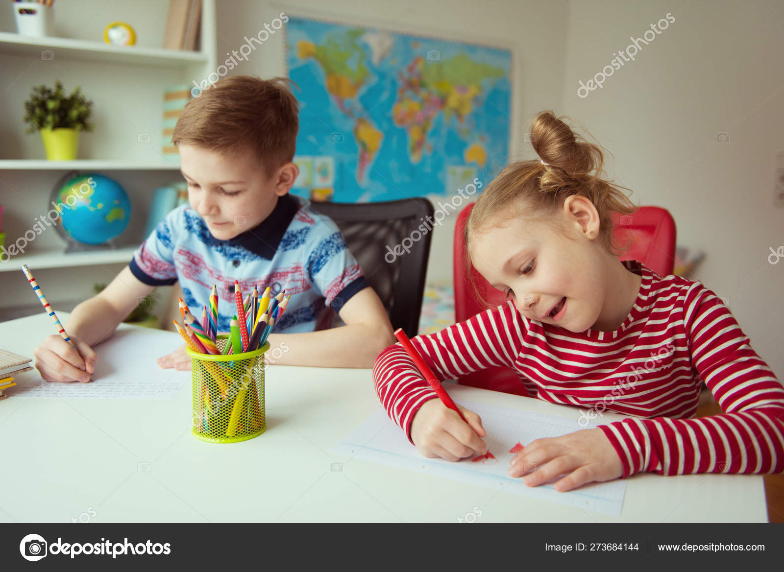 Two cute children drawing with colorful pencils Stock Photo by ...