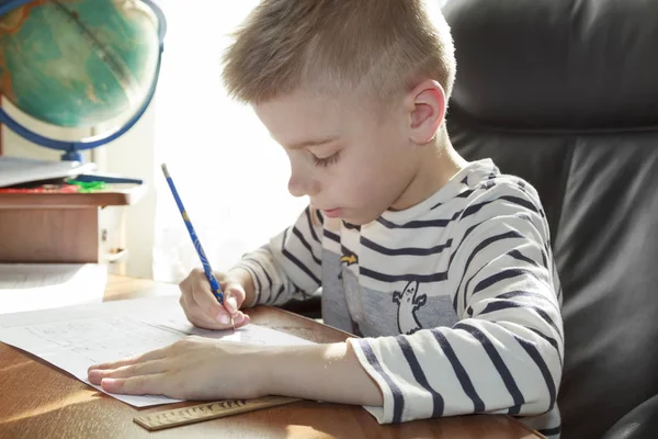 School-age boy crying and screaming while doing homework. the co Stock ...
