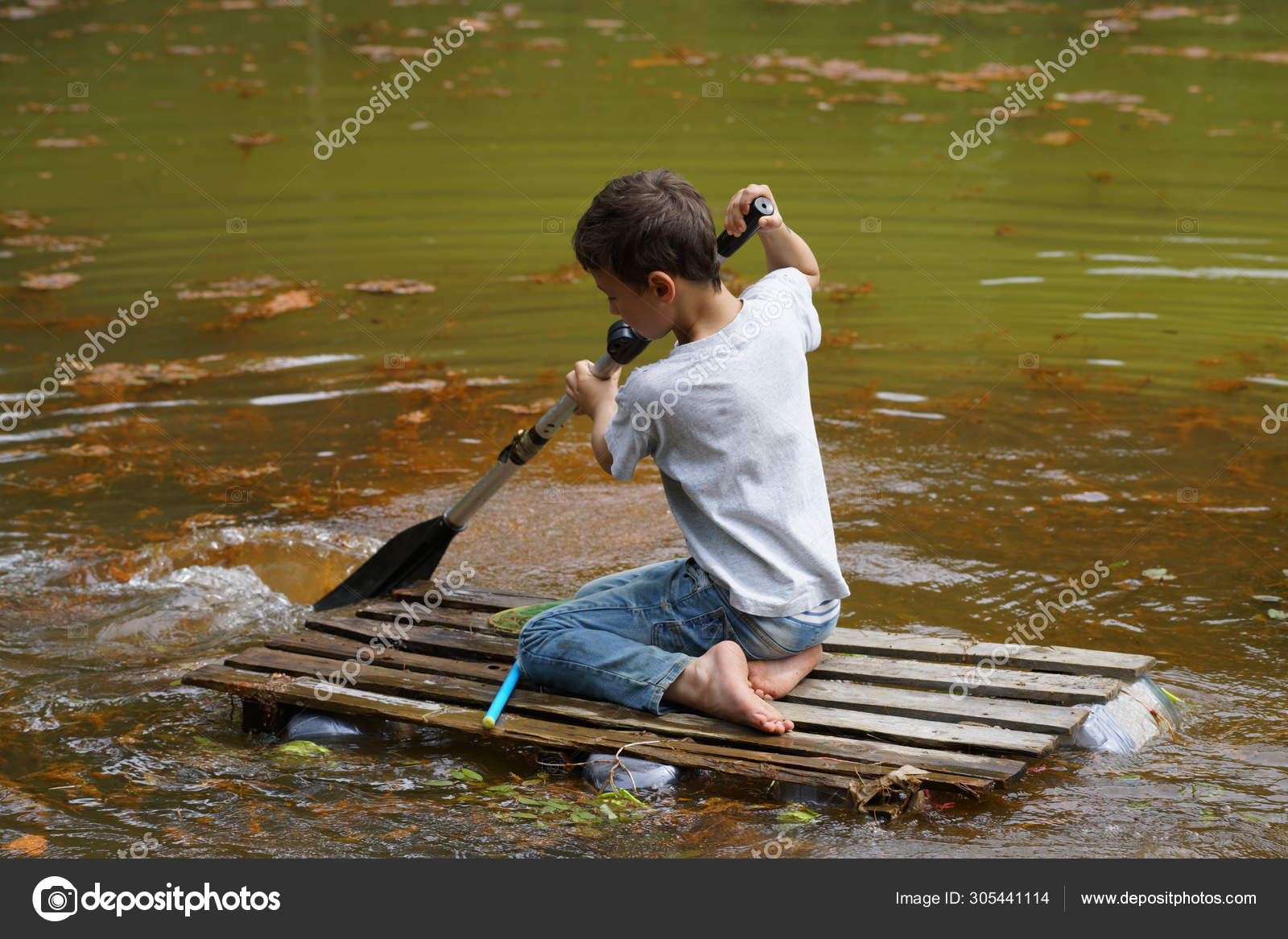 Boy floating on a raft — Stock Photo © konstantin32 #305441114