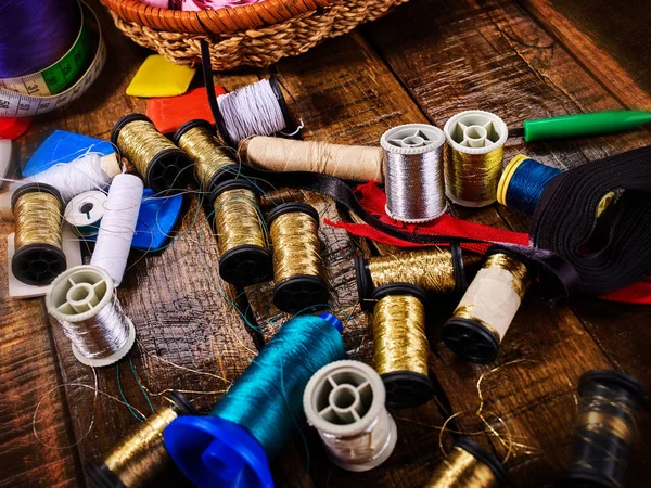 Coil threads for overlock and measuring tape on serger background Stock ...