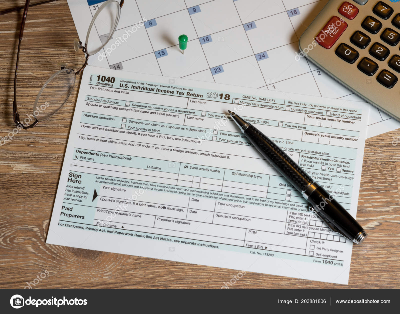 Form 1040 Simplified allows filing of taxes on postcard Stock Photo by ...