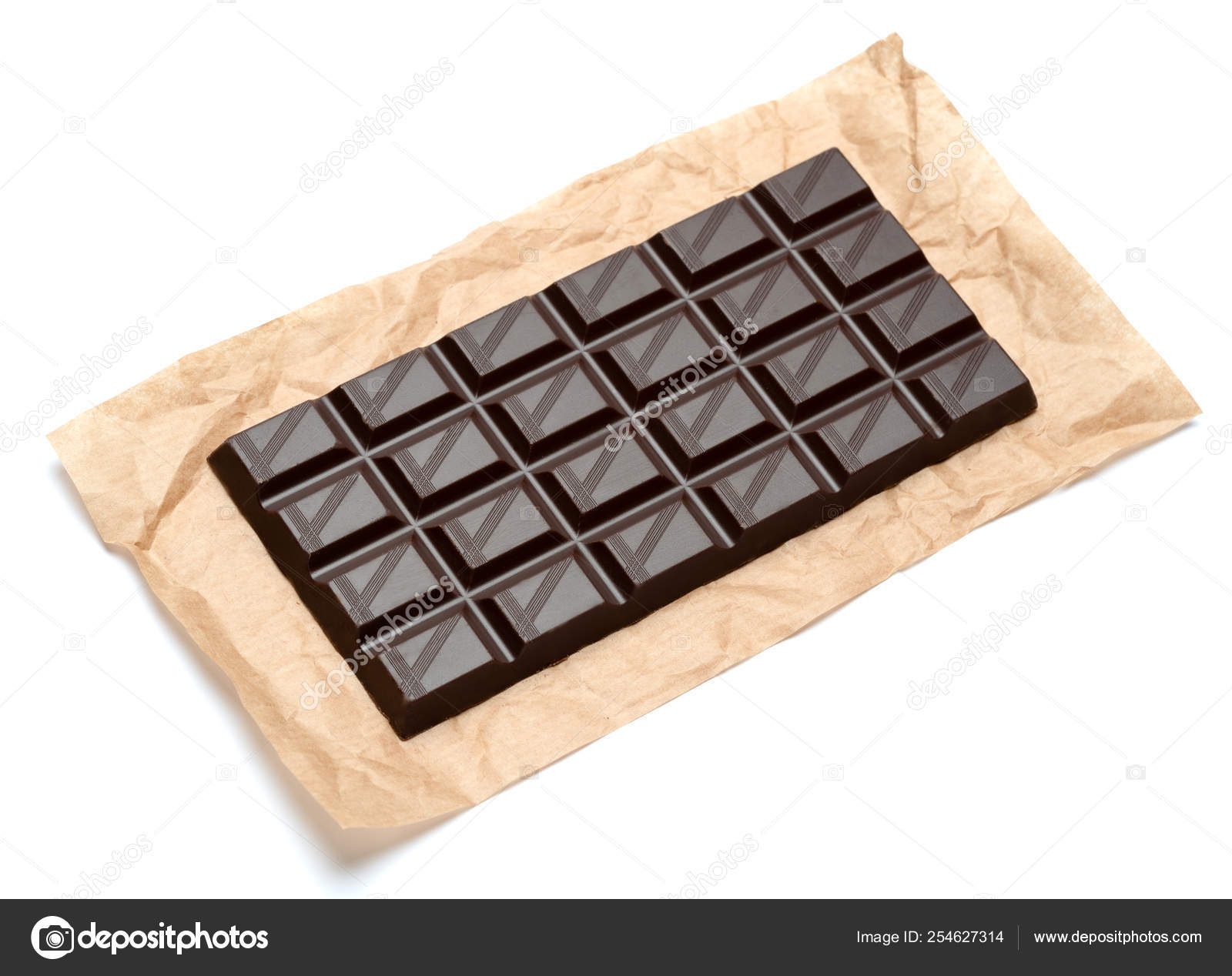 Dark chocolate bar on craft packaging paper isolated on white ...