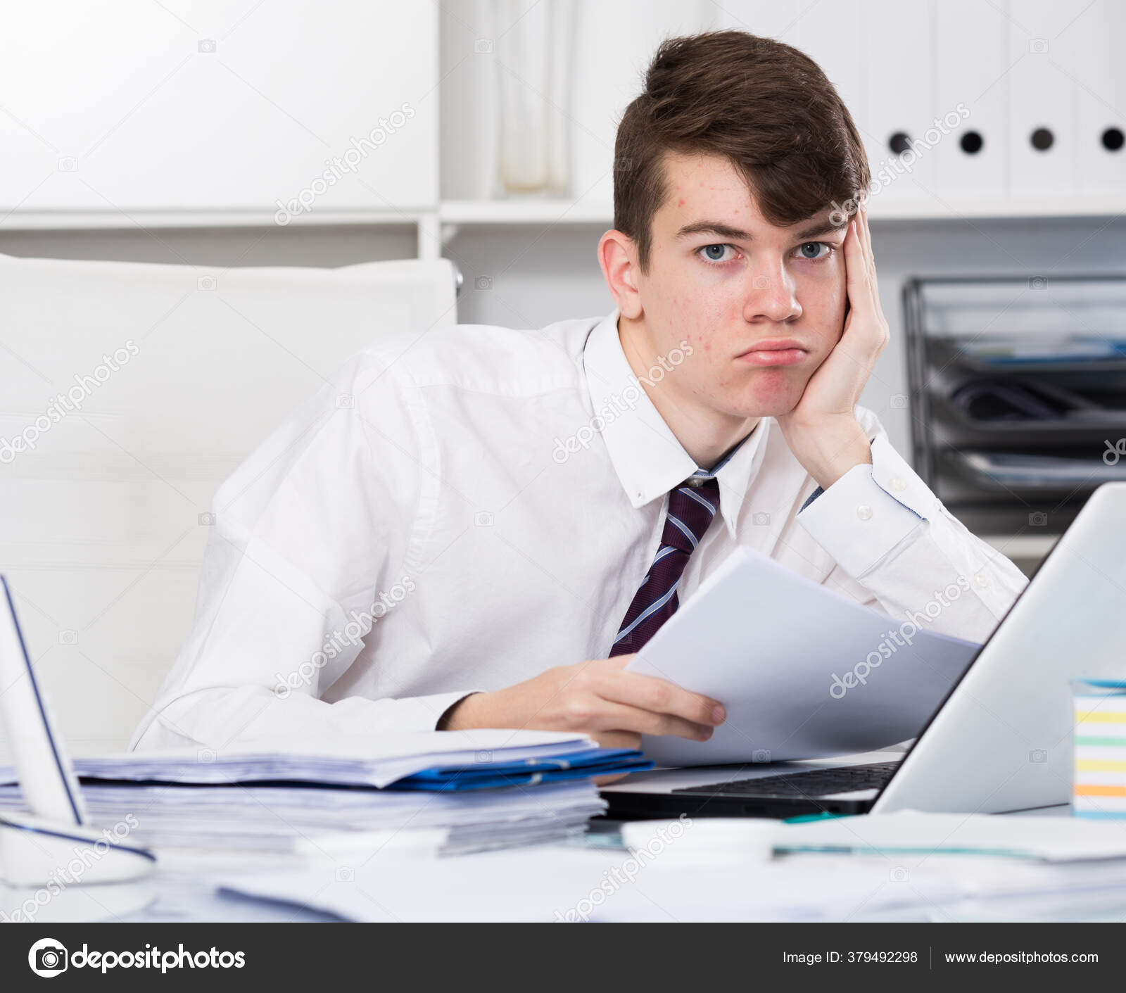 Boring Teenager Reading Documents Laptop Office — Stock Photo © Jim ...