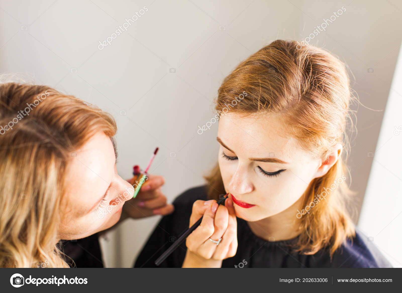 Beautiful woman face with red lipstick Stock Photo by ©oksixx 202633006
