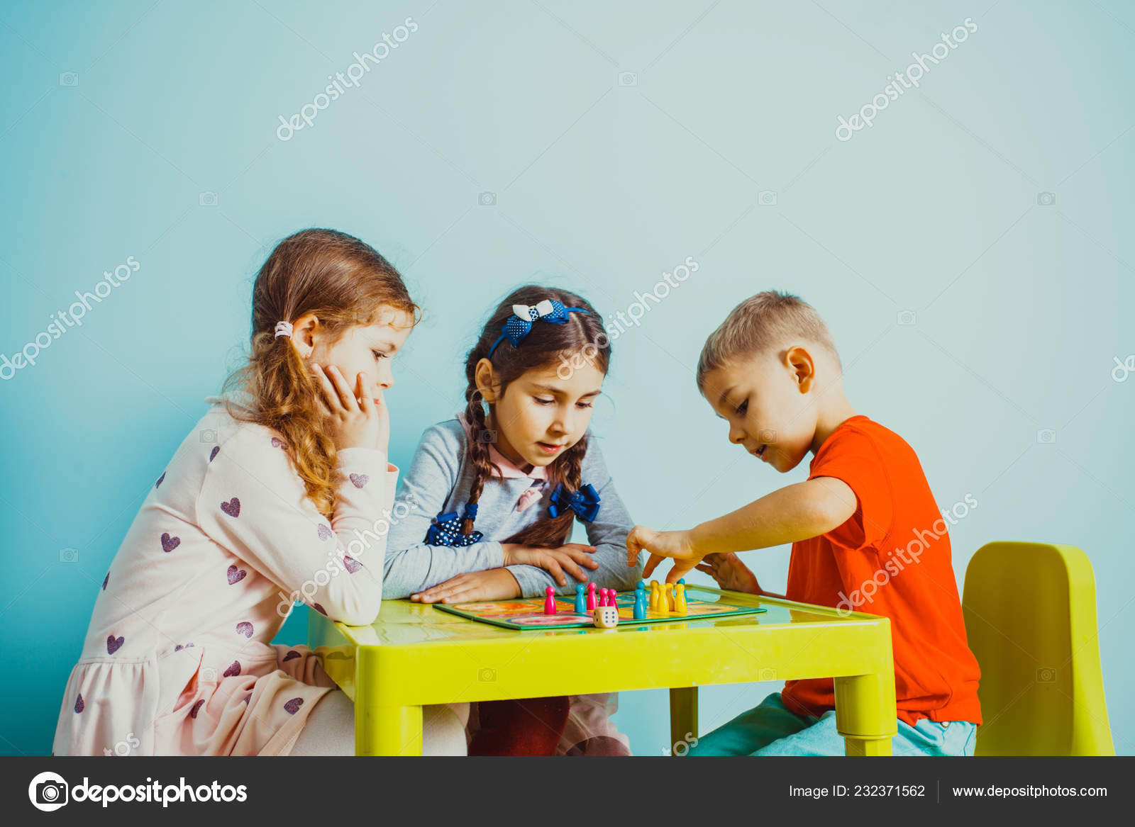 Kids playing together sitting around the table Stock Photo by ©oksixx ...