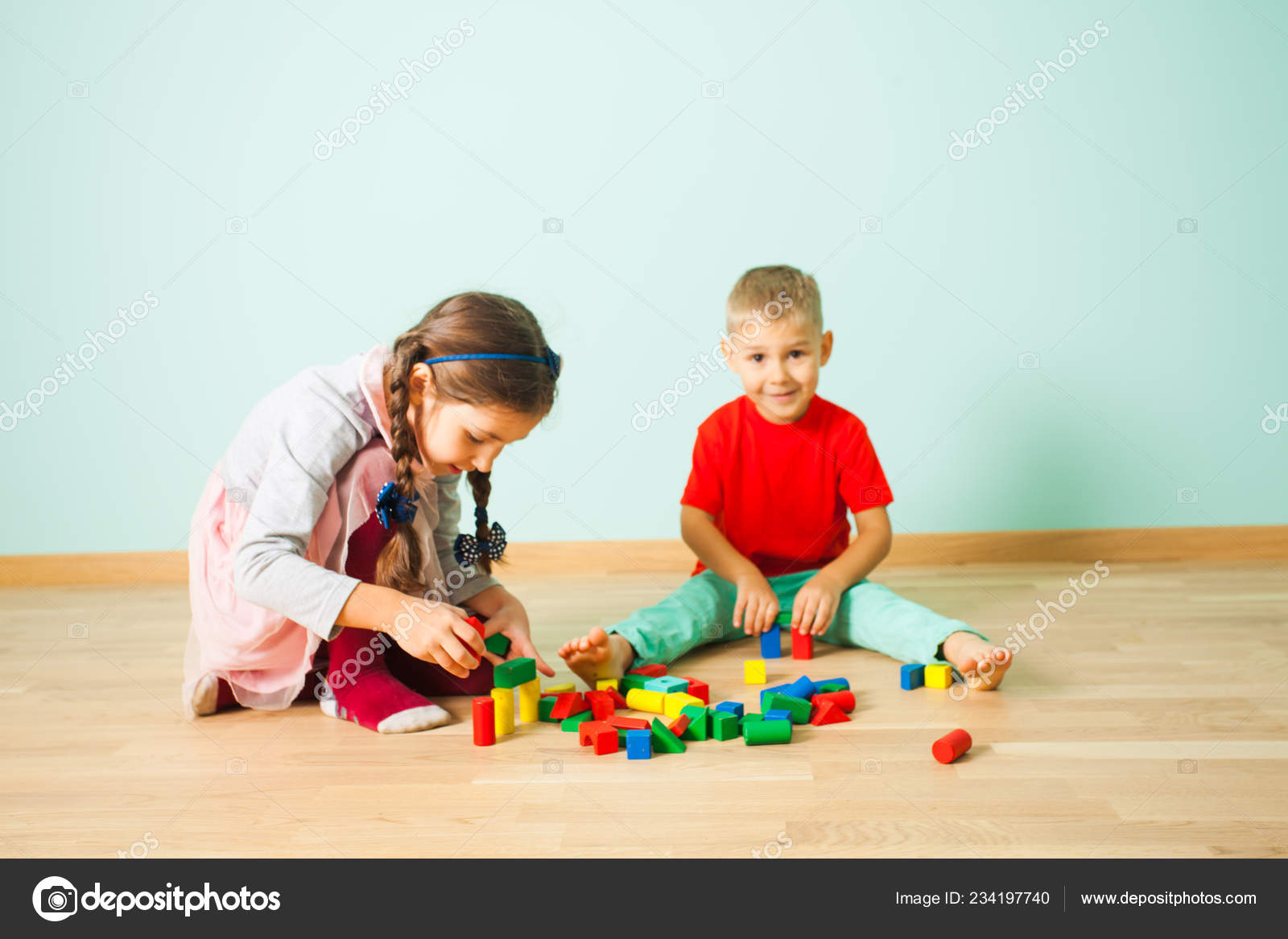 Two kids playing with wooden blocks at home. — Stock Photo © oksixx ...