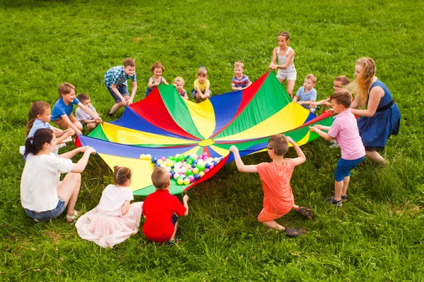 Kids in a circle playing social game Stock Photo by ©oksixx 387076248