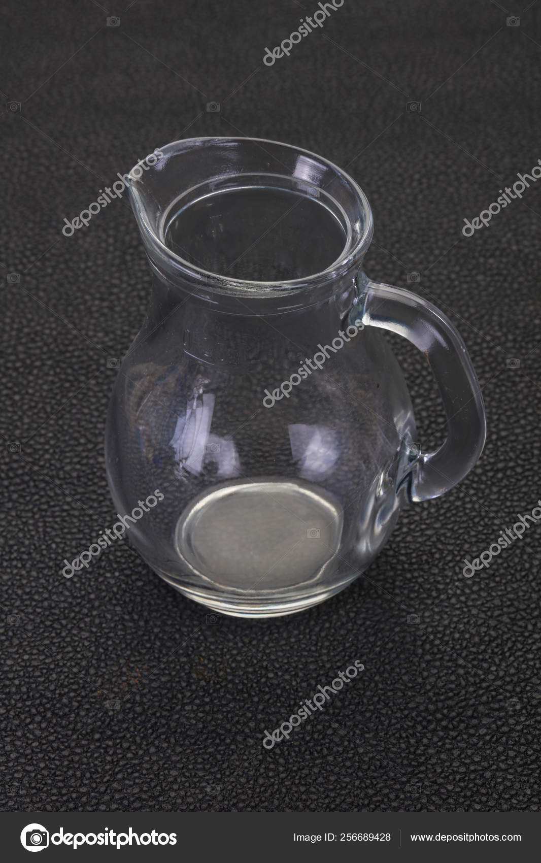 Empty Glass Jug Black Background — Stock Photo © AndreySt #256689428