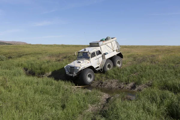 All-terrain vehicle rides on the road in the tundra, Yamal, Russia ...