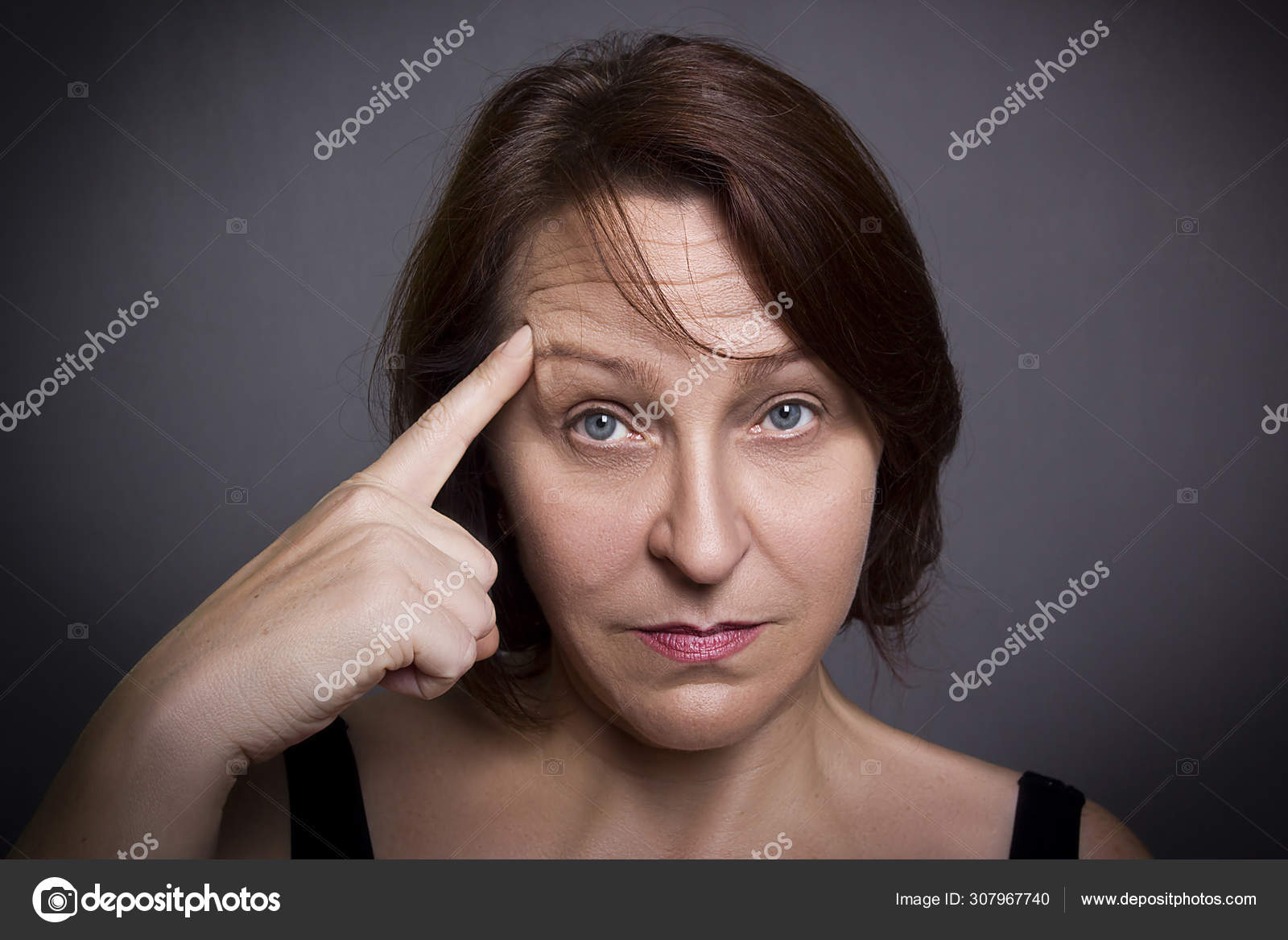 Woman grimaces in front of camera — Stock Photo © VIPDesignUSA #307967740
