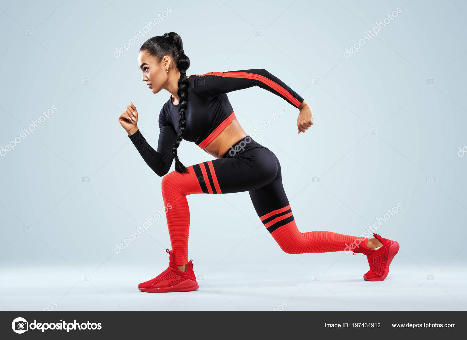 A strong athletic, women sprinter, running wearing in the sportswear ...