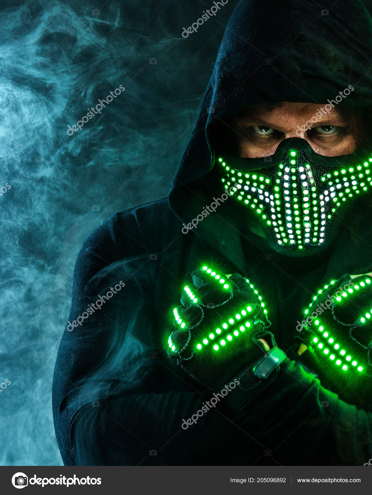 Mysterious man in black wear, neon mask and gloves. Character pastor or ...
