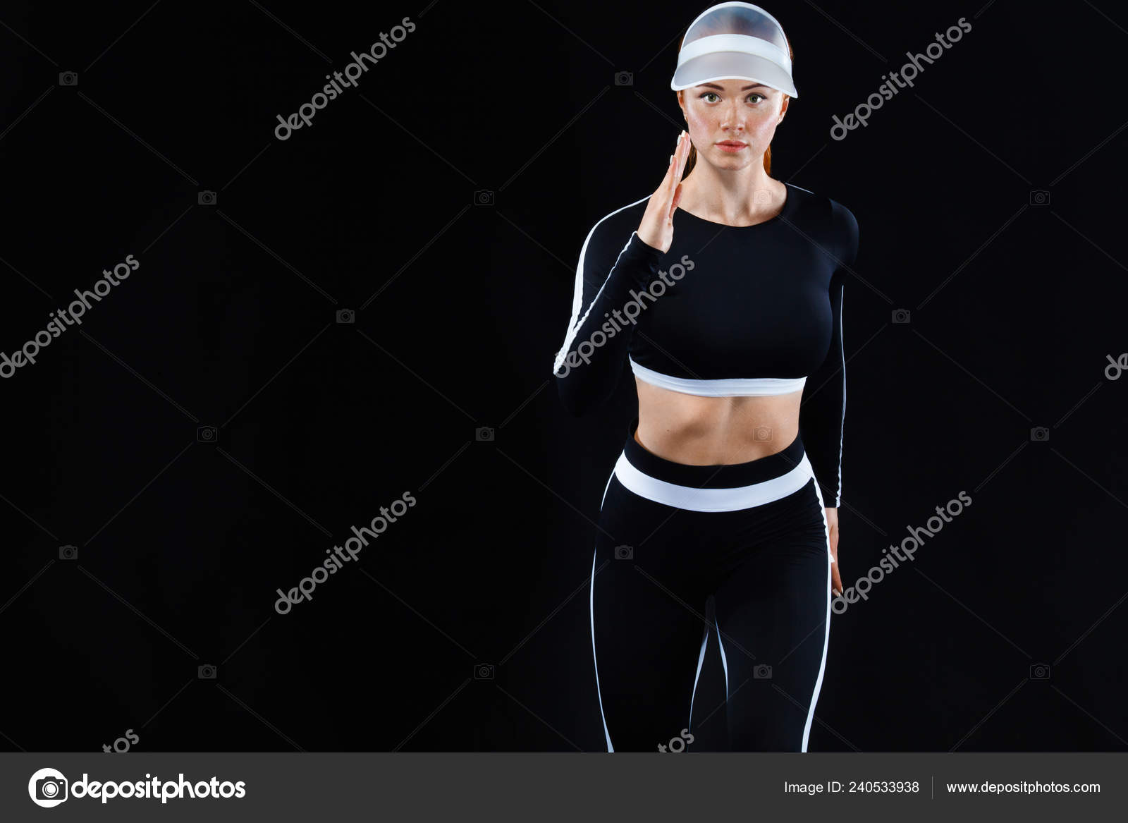 Strong athletic woman sprinter, running on black background wearing in ...