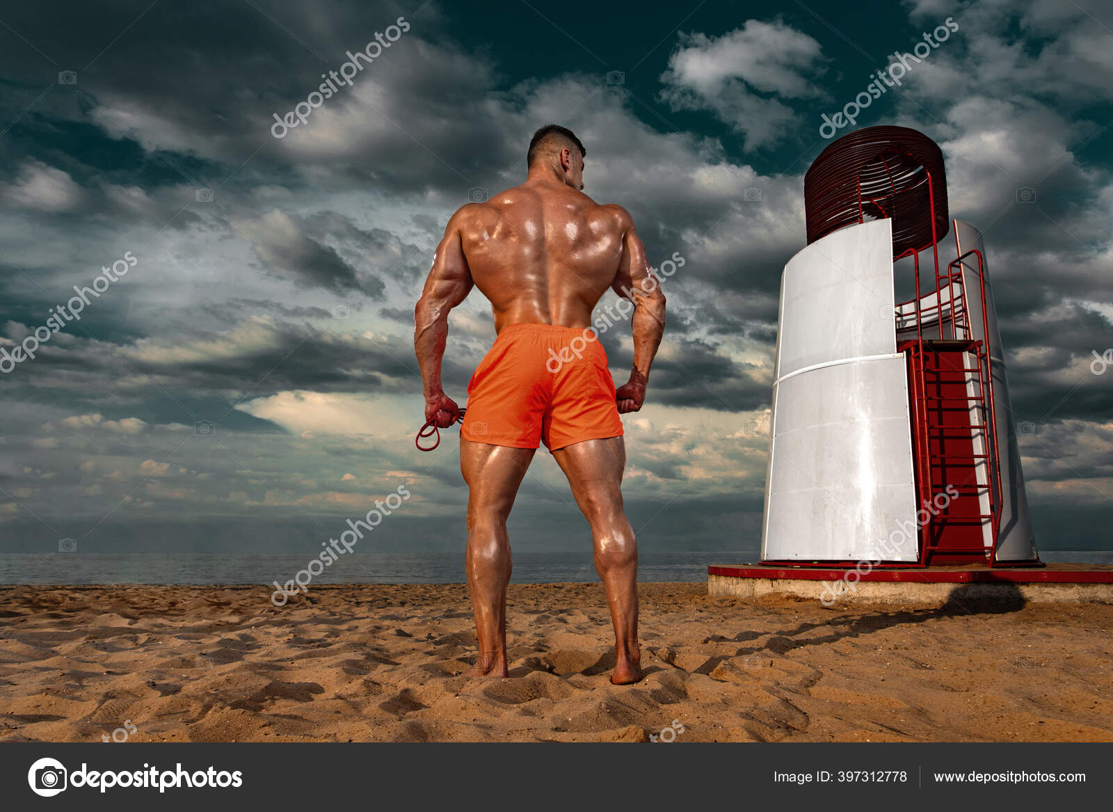 Fit Athlete Bodybuilder On The Beach Attractive Young Man Lifeguard