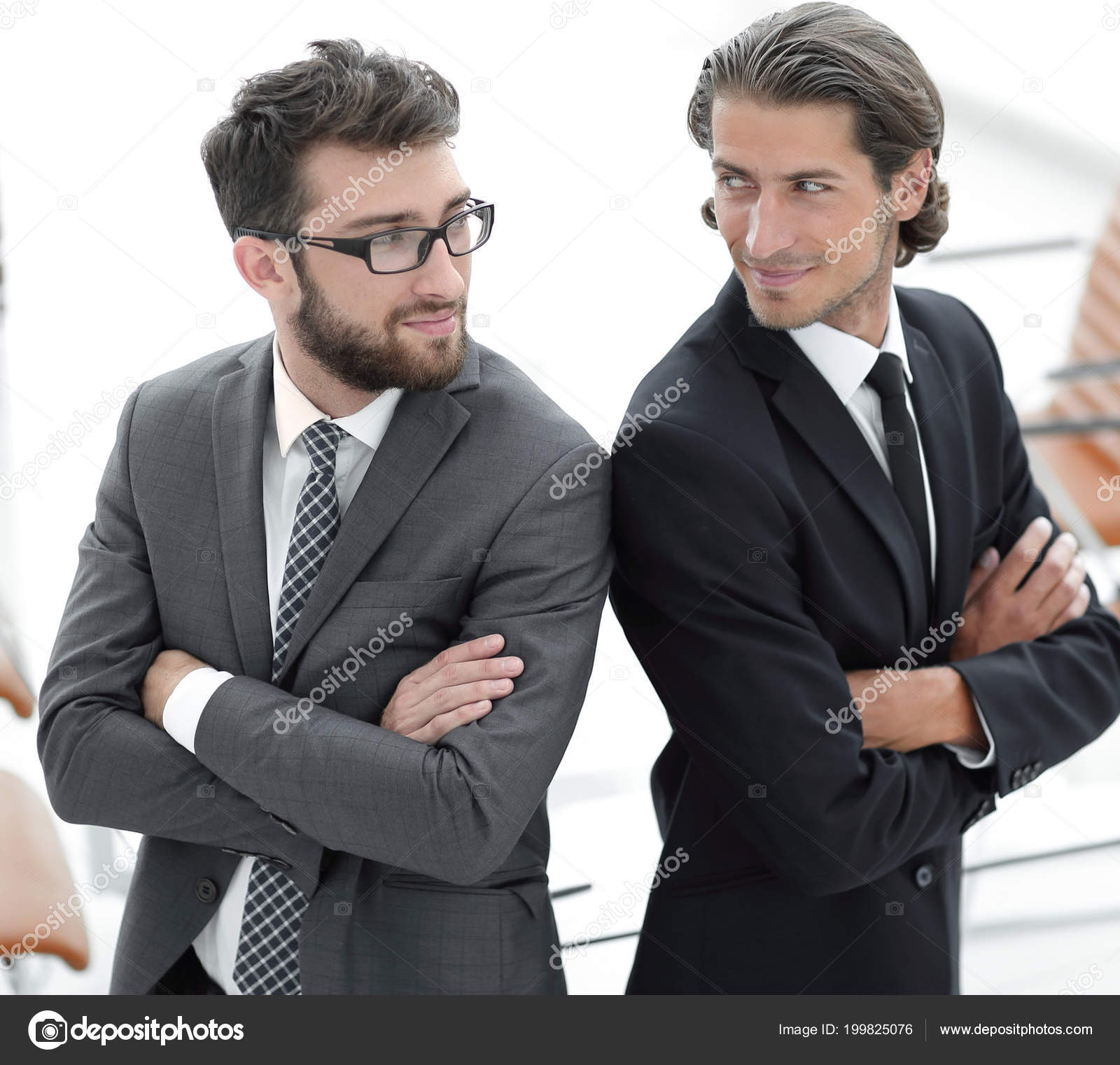 Two Men Standing Back To Back