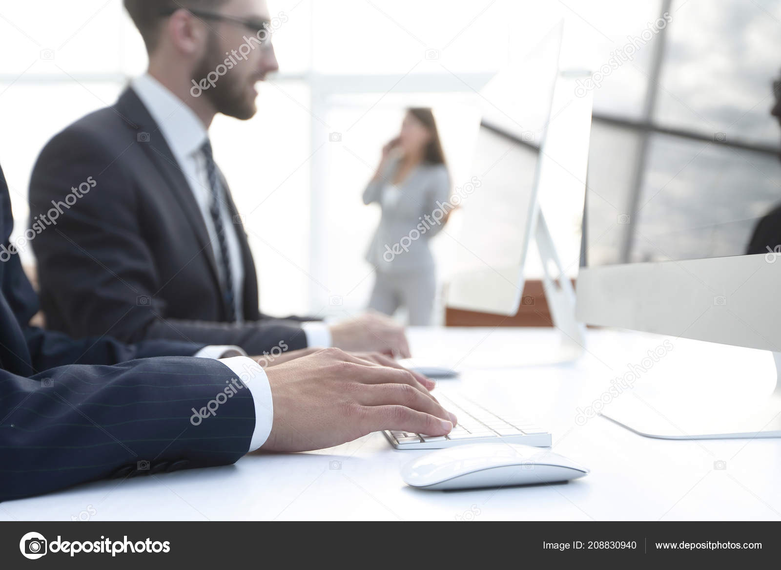 Employees working on computers Stock Photo by ©depositedhar 208830940