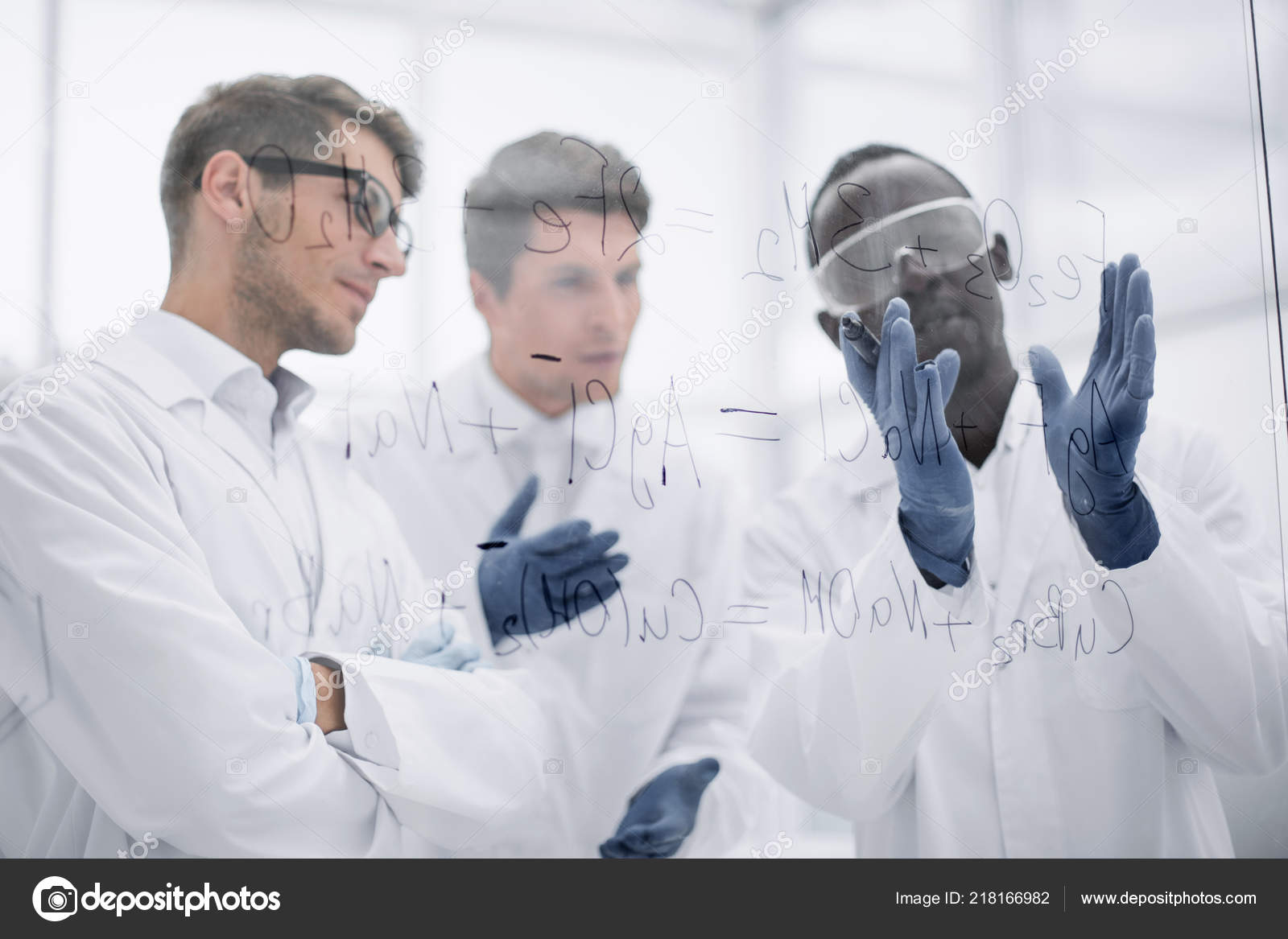 Group of scientists talking standing near a glass Board. — Stock Photo ...