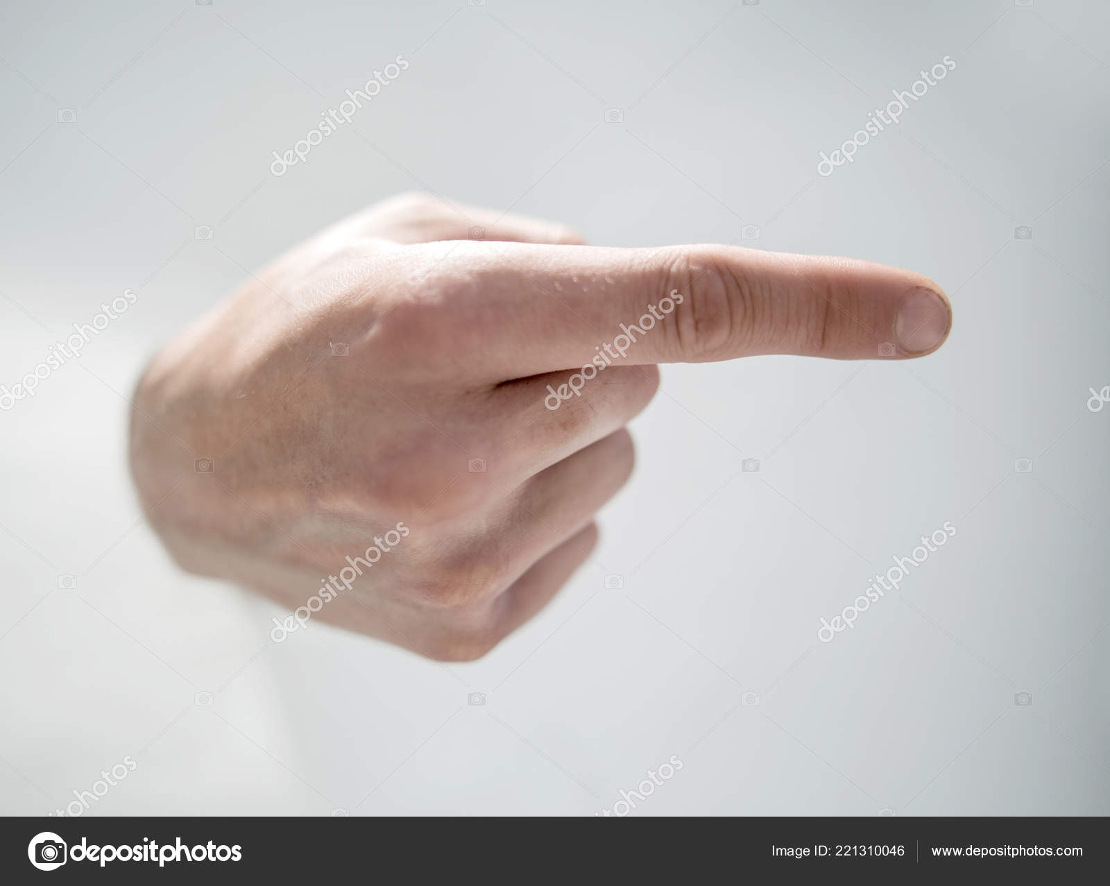 Close up.a mans hand breaking through the paper and pointing so — Stock ...