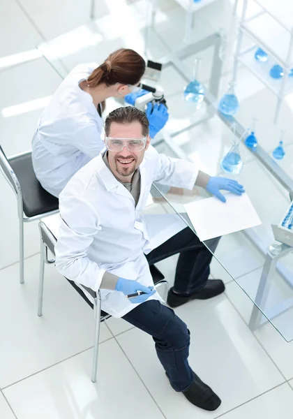 top view.laboratory staff at the workplace - Stock Image - Everypixel