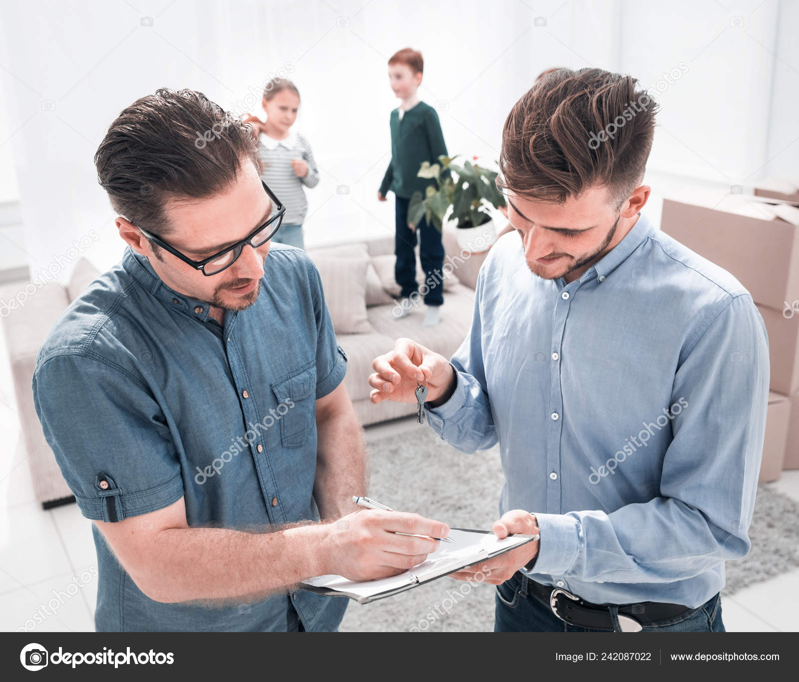 Client signs the lease agreement in the new apartment. Stock Photo by ...
