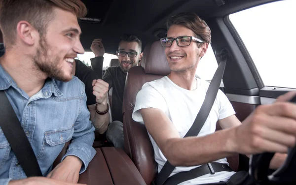 close up.happy friends talking in the car. - Stock Image - Everypixel
