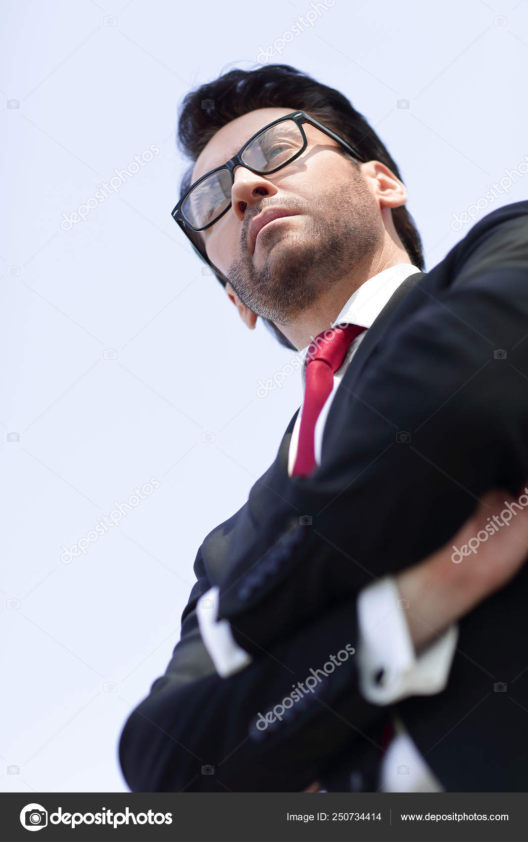 Close up. confident businessman looking forward — Stock Photo ...