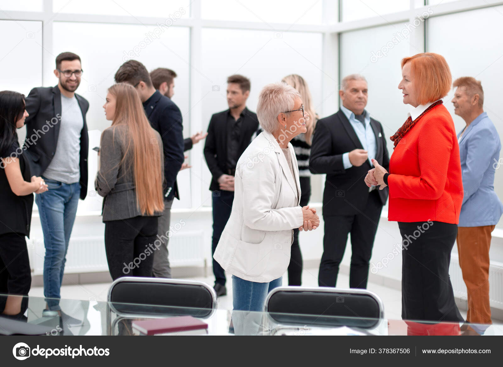Friendly colleagues consulting after working meeting — Stock Photo ...