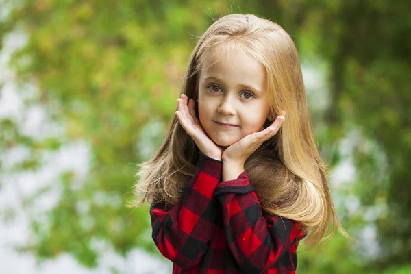 Beautiful blonde little girl Stock Photo by ©arkusha 147315255
