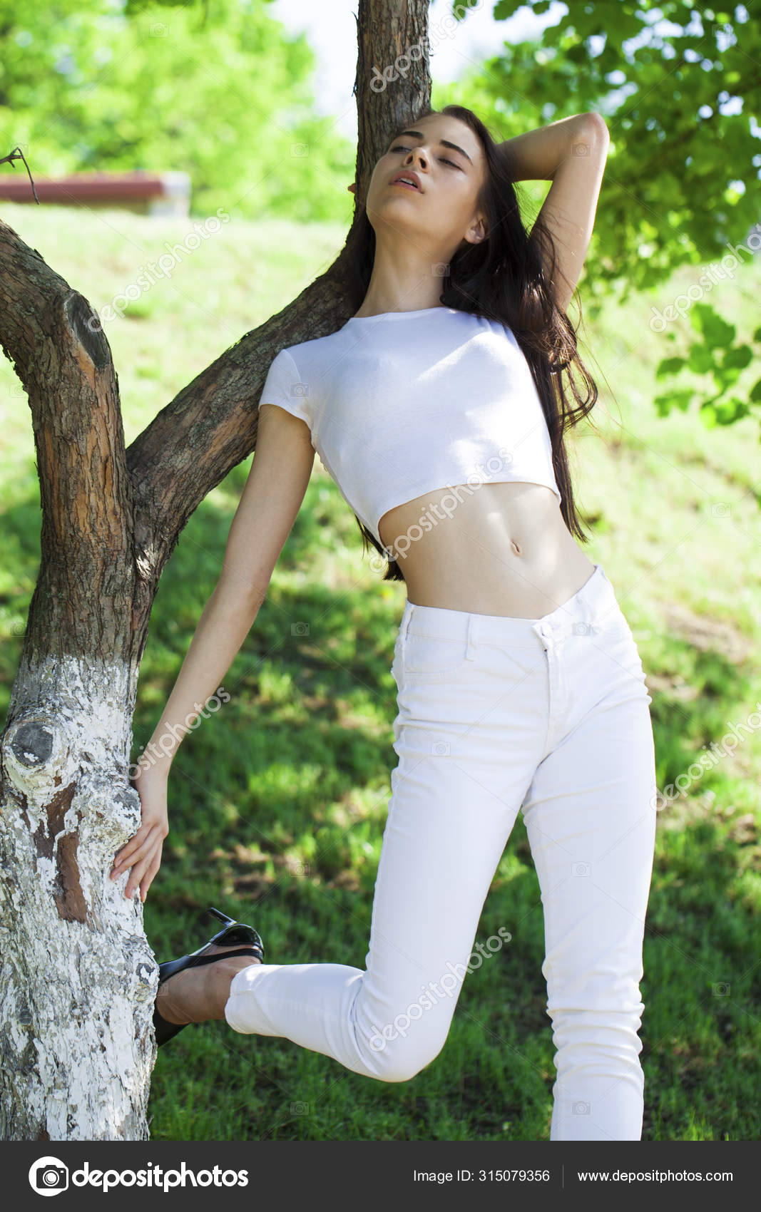 Beautiful Brunette Woman Posing Against Summer Park Bright Sunn Stock