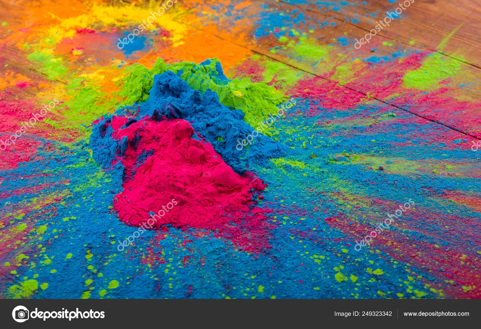 Abstract colorful Happy Holi background. Color vibrant powder on wood ...