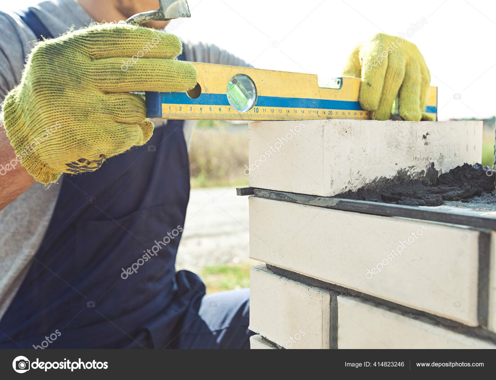 Worker Builds Fence Post Bricks Stock Photo by ©Olegkalina 414823246