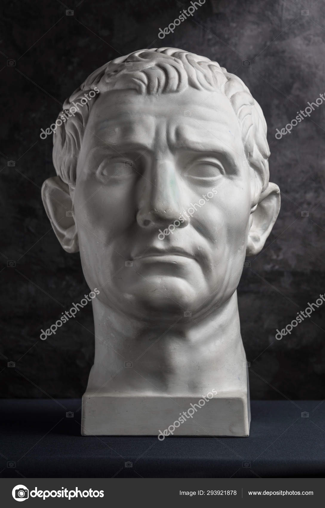 Gypsum copy of ancient statue Augustus head on dark textured background ...