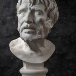 Gypsum copy of ancient statue Seneca head on dark textured background ...
