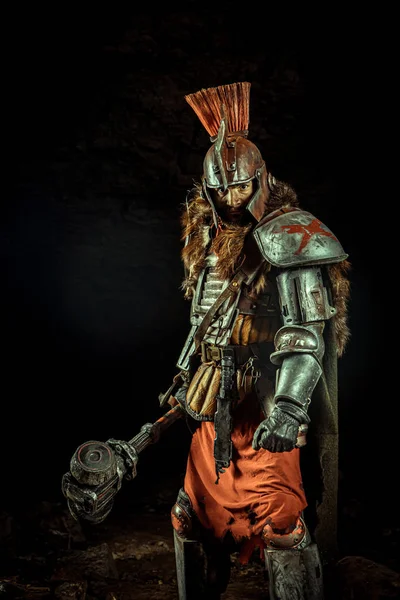 Powerful knight in the armor with the hammer. Isolated on black ...