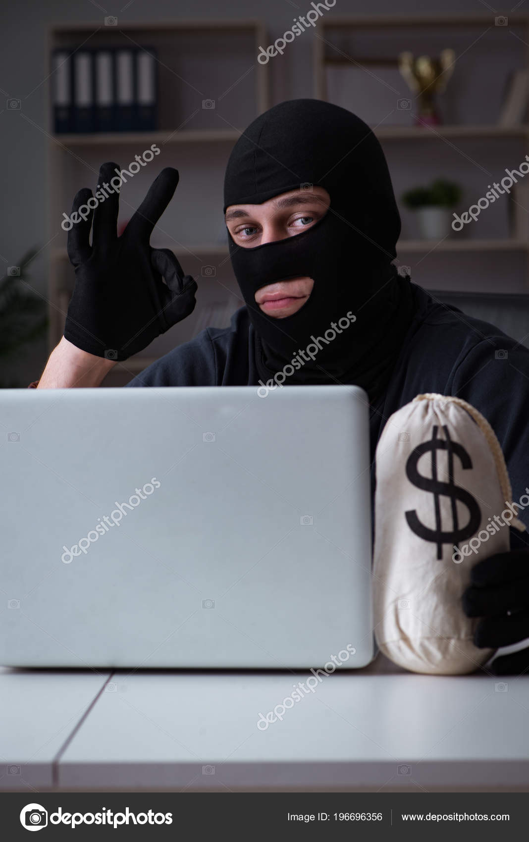 Hacker hacking computer late at night — Stock Photo © Elnur_ #196696356