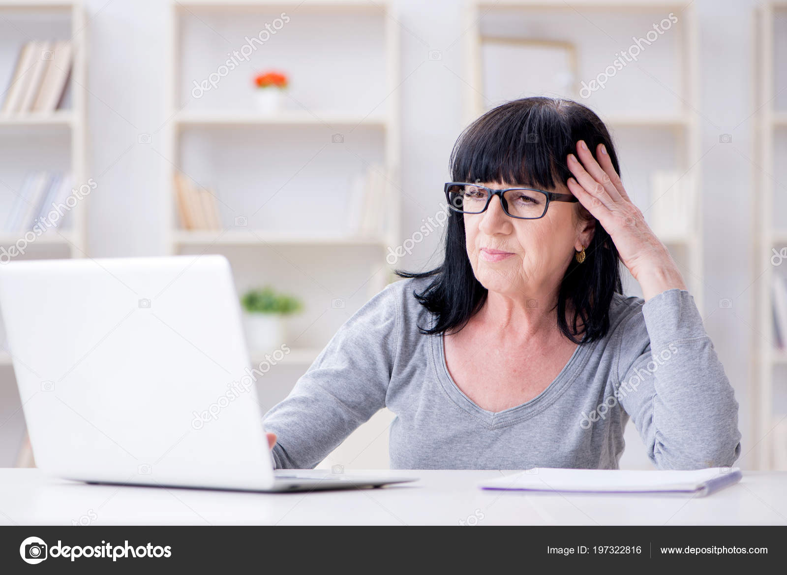 Senior woman struggling at computer — Stock Photo © Elnur_ #197322816