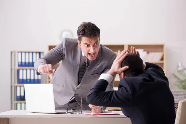 Image of employee yelling at black boss in hallway Stock Photos ...