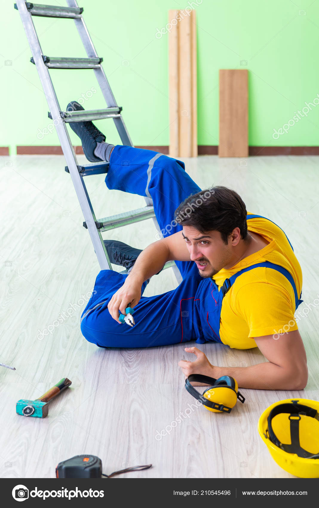 Injured worker at the work site — Stock Photo © Elnur_ #210545496