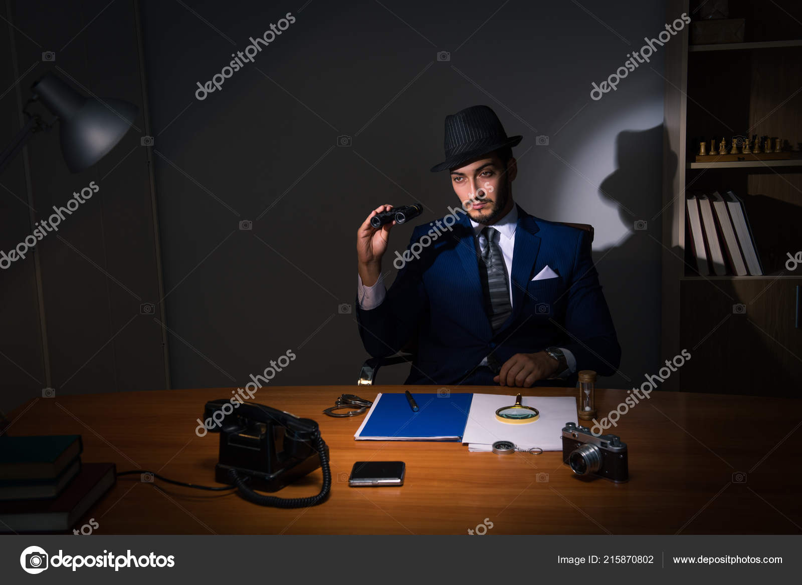 Detective sitting in dark room in vintage concept Stock Photo by ©Elnur ...