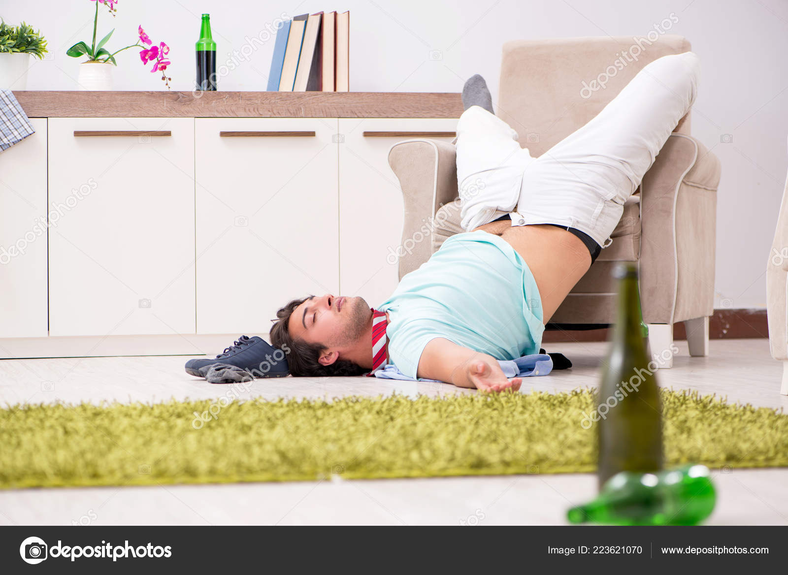 Young drunk handsome man after party at home — Stock Photo © Elnur ...