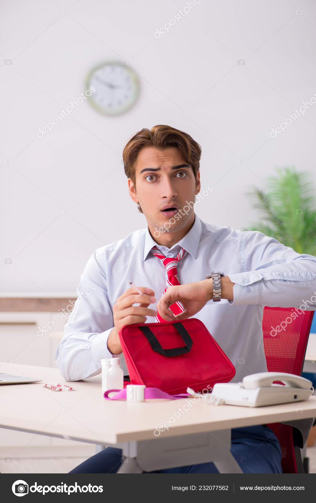 Man with first aid kit in the office — Stock Photo © Elnur_ #232077562
