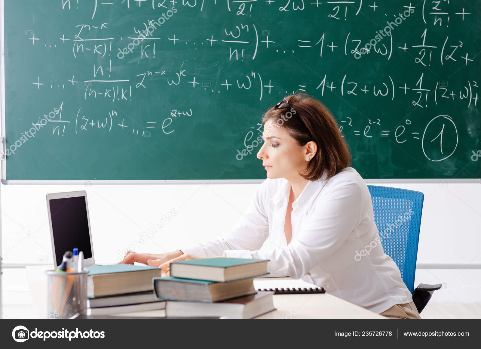 Female math teacher in front of the chalkboard — Stock Photo © Elnur ...