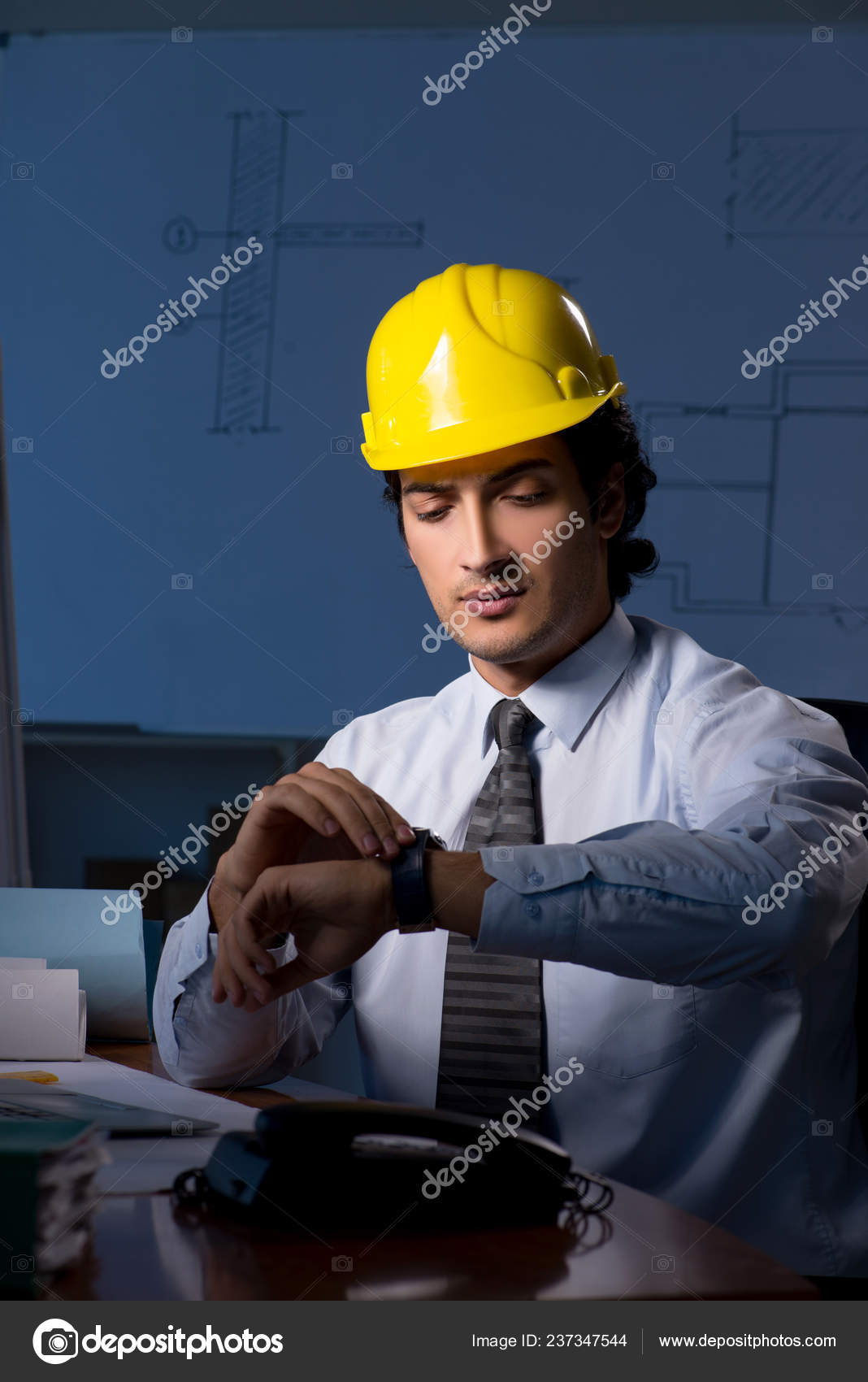 Young construction architect working on project at night — Stock Photo ...
