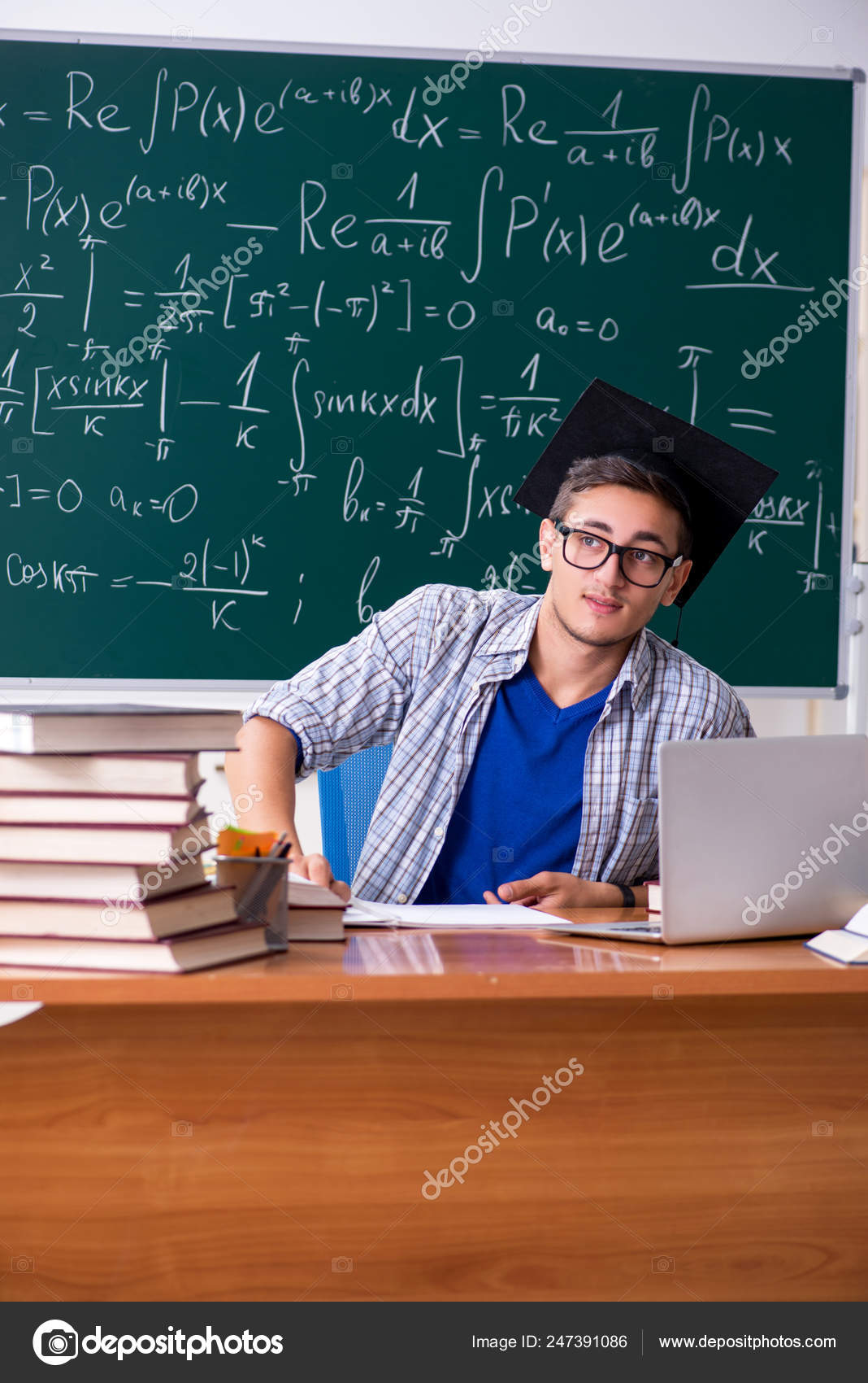 Young male student studying math at school — Stock Photo © Elnur ...