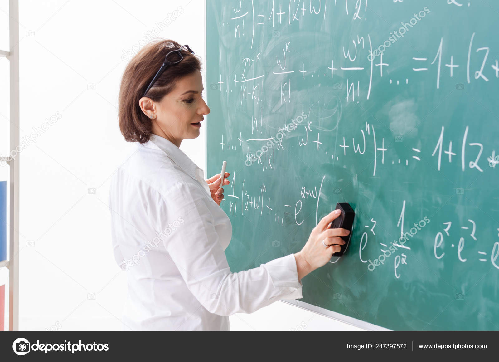Female math teacher in front of the chalkboard — Stock Photo © Elnur ...