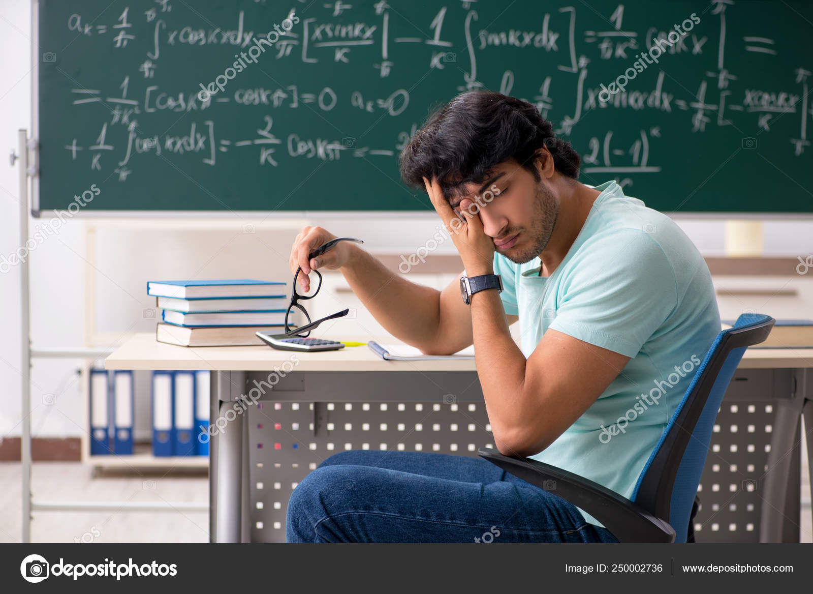 Young male student mathematician in front of chalkboard — Stock Photo ...