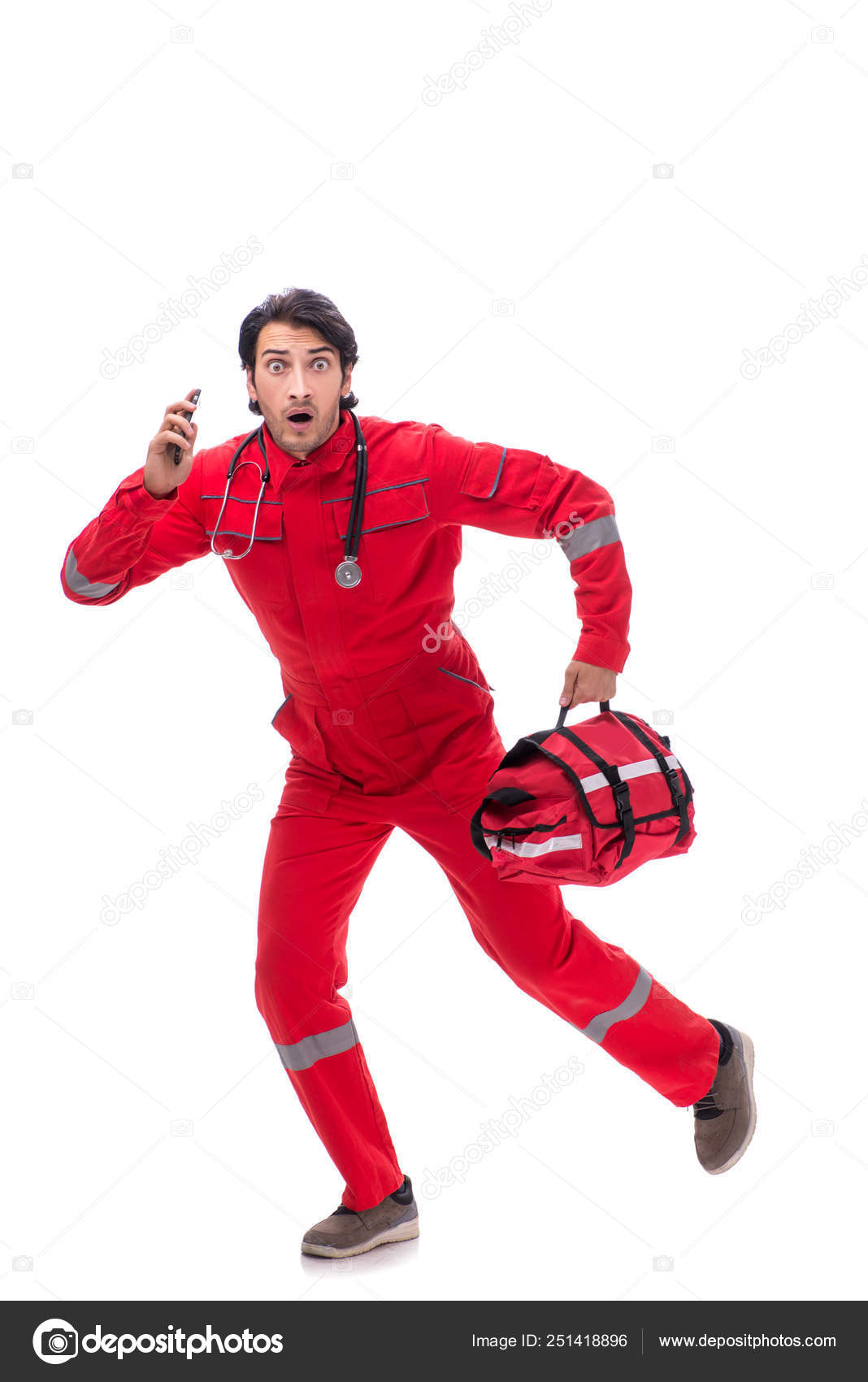 Young paramedic in red uniform isolated on white Stock Photo by ©Elnur ...