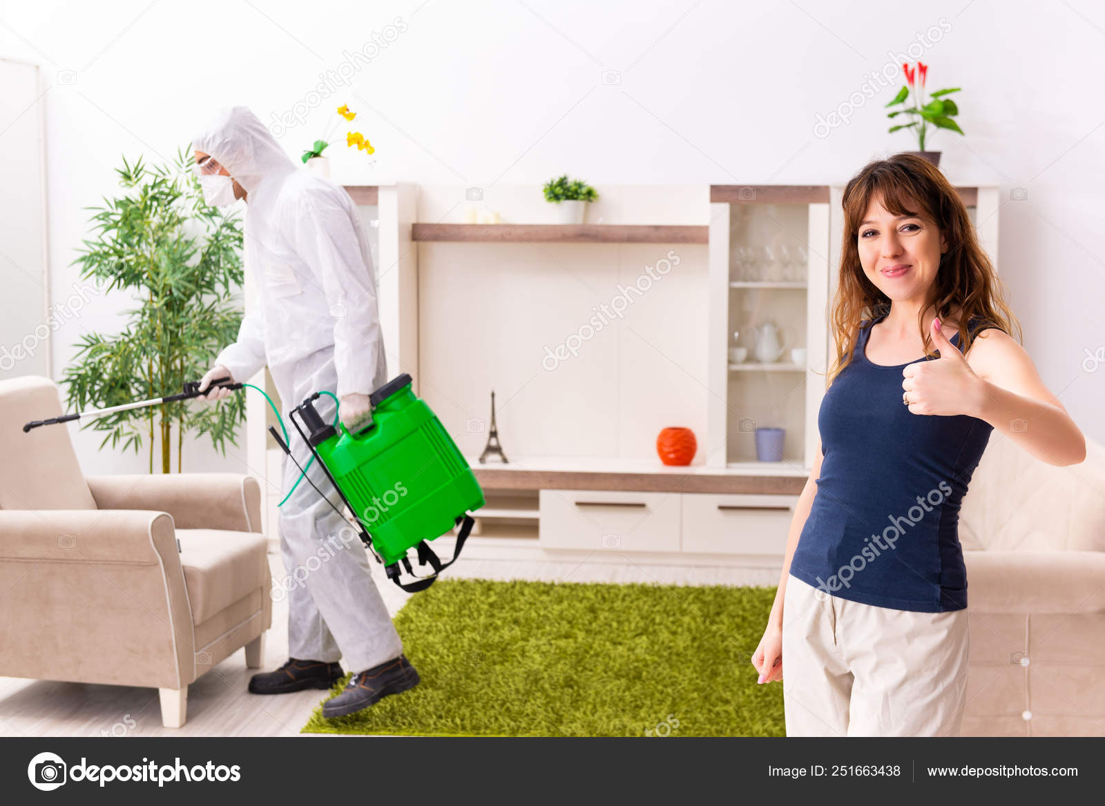 Young professional contractor doing pest control at flat Stock Photo by ...