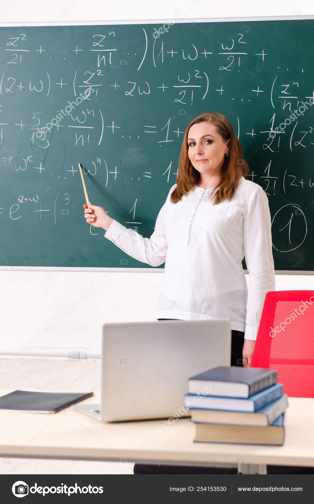 Female math teacher in the classroom — Stock Photo © Elnur_ #254153530
