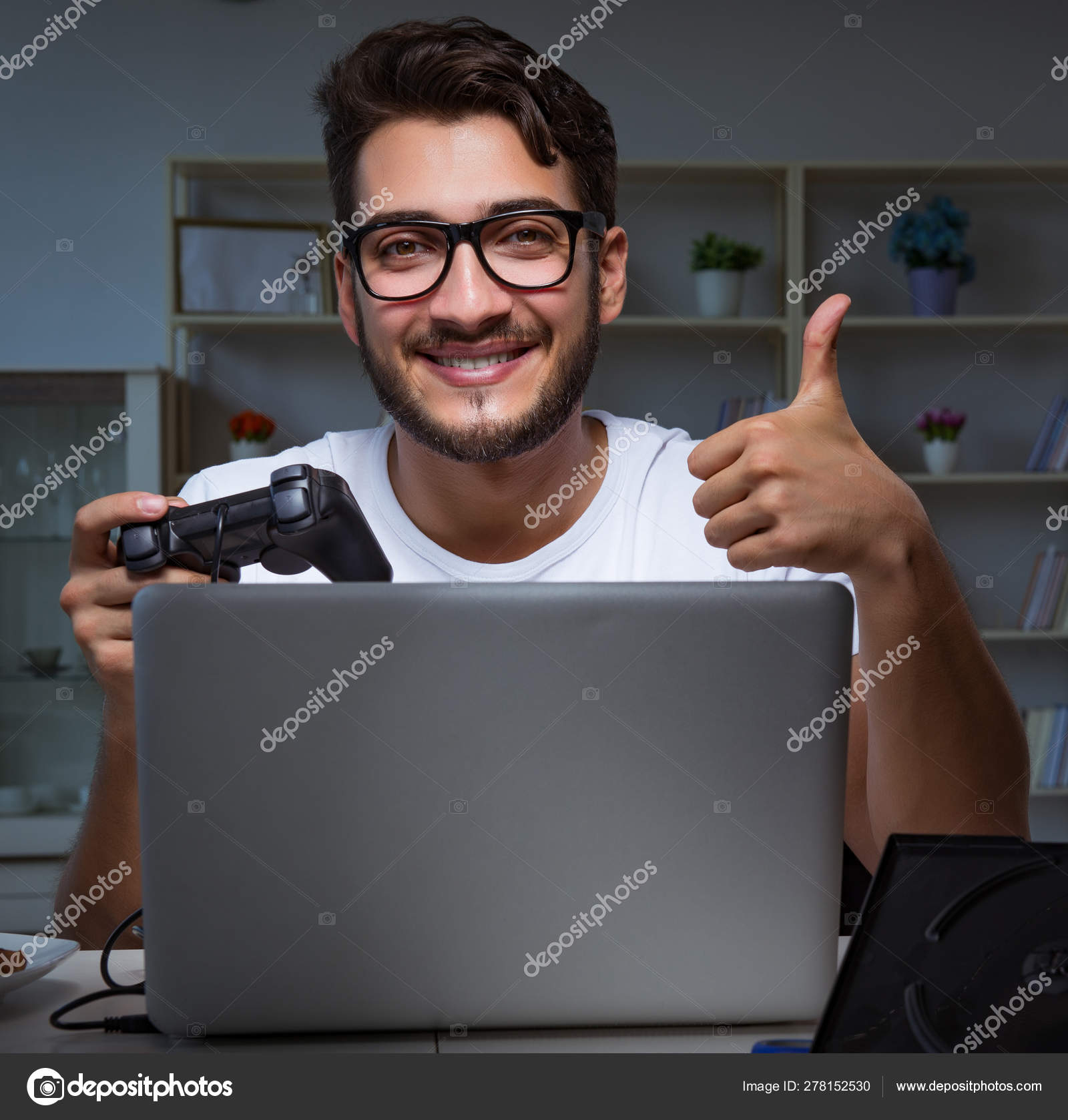 Young man playing games long hours late in the office — Stock Photo ...